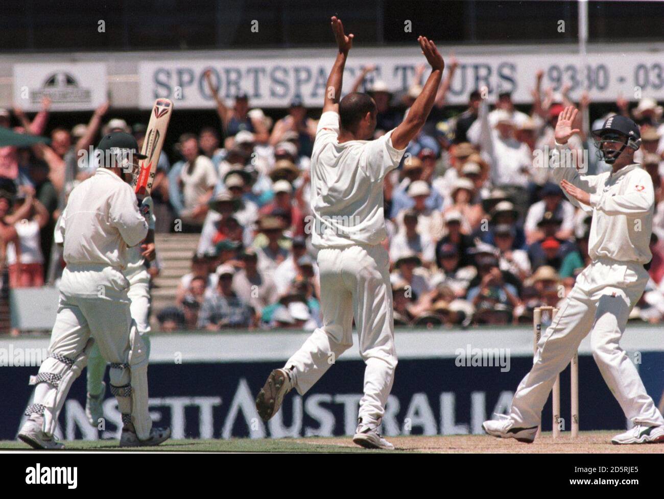 England's Dean Headley celebrates the wicket of Australia's Justin ...