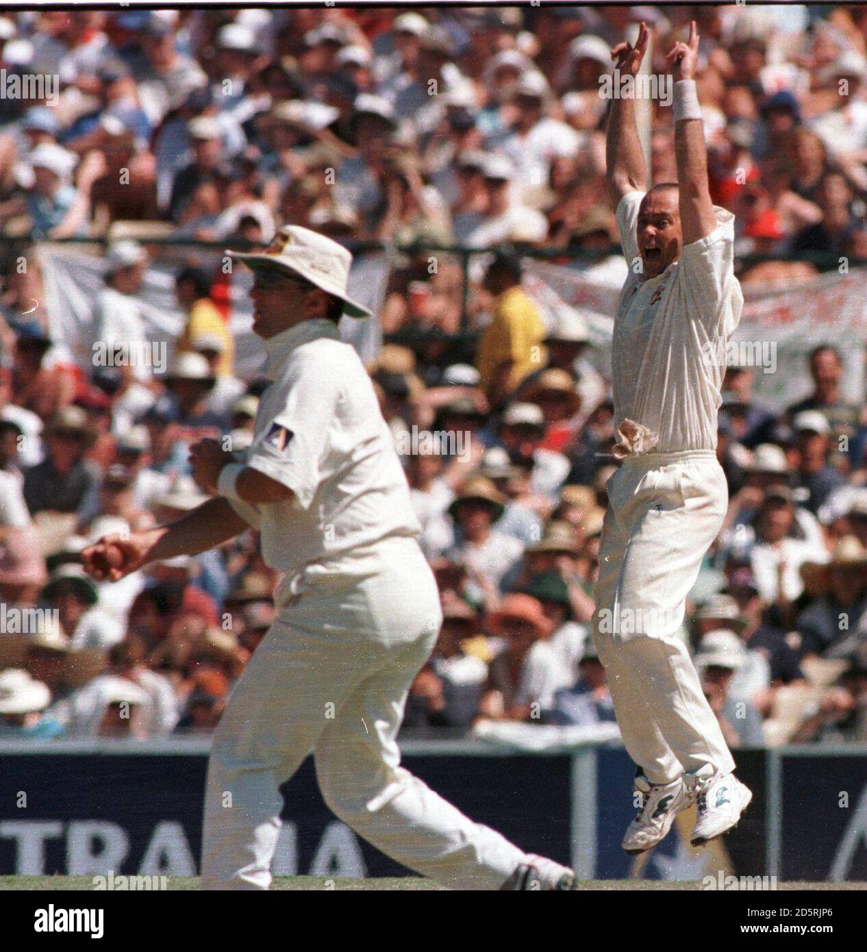 Australia's Colin Miller celebrates the dismissal of England's Warren ...