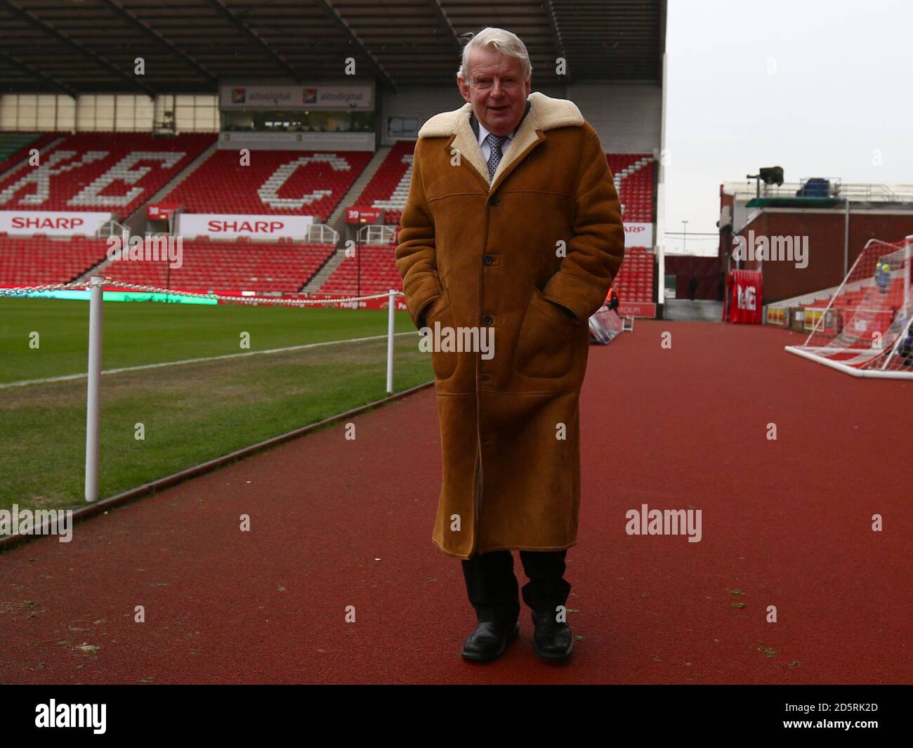 TV commentator John Motson arrives in his trademark Sheepskin jacket ...