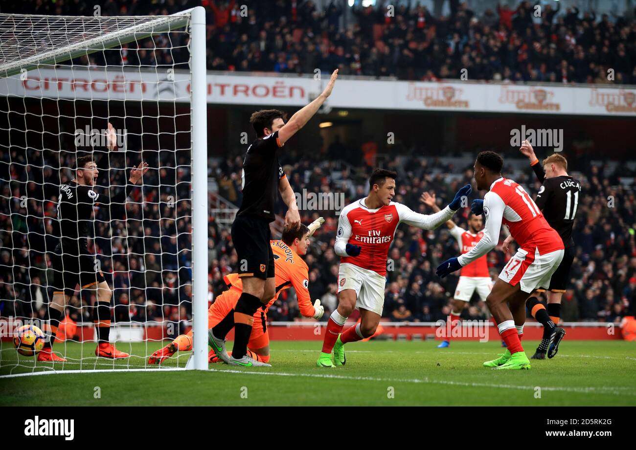 Arsenal's Alexis Sanchez (centre) celebrates scoring his side's first ...