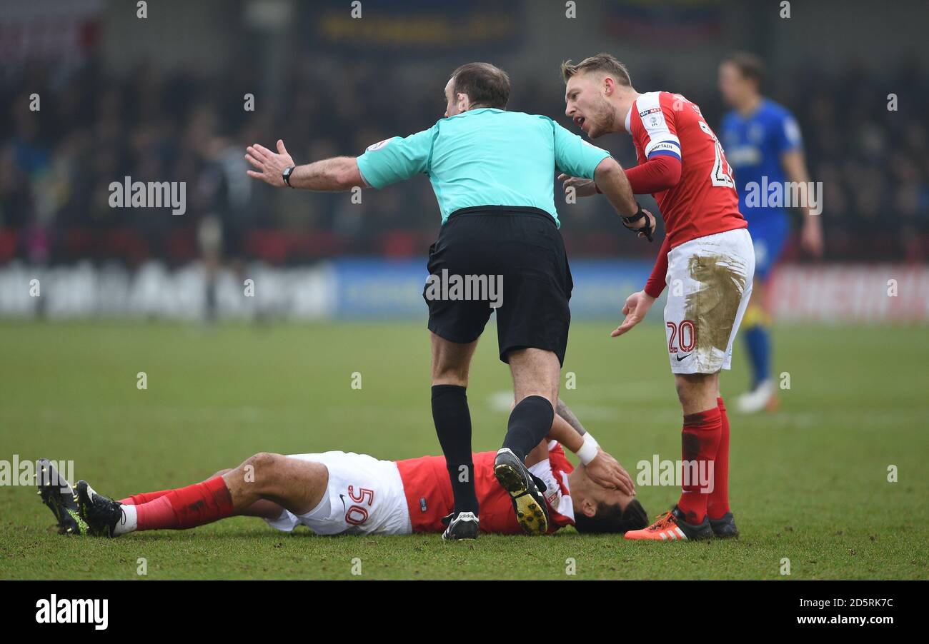Charlton Athletic's Jorge Teixeira lies injured on the pitch as Chris ...