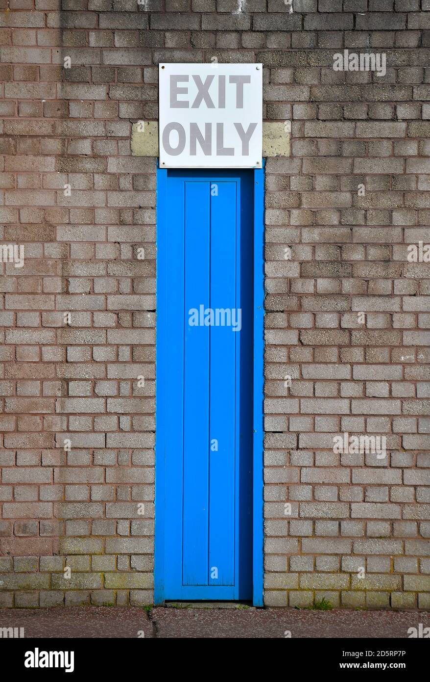 An Exit Only sign above a door at Turf moor Stock Photo - Alamy