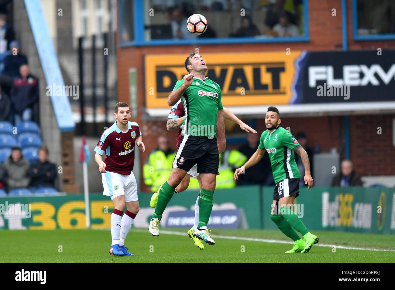 Lincoln City's Matt Rhead jumps for the ball Stock Photo - Alamy
