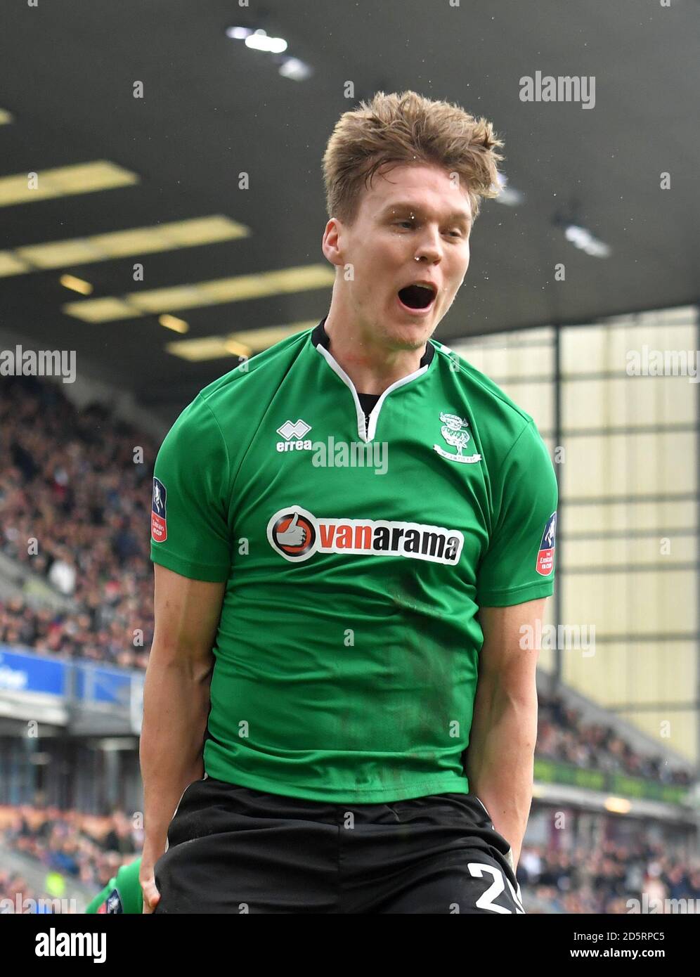 Lincoln City's Sean Raggett celebrates scoring his side's first goal of ...