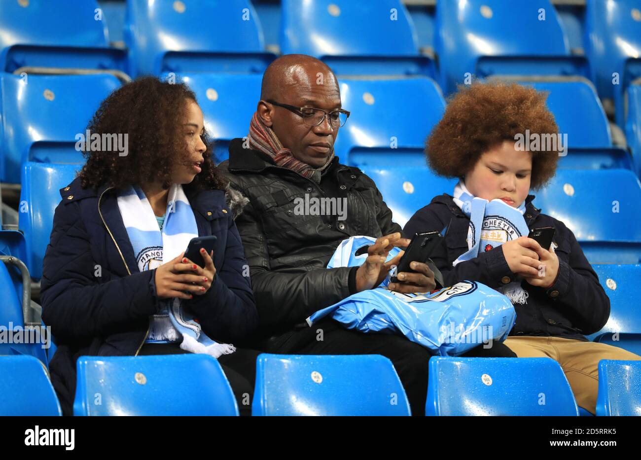 Manchester City fans wait for kick off Stock Photo - Alamy