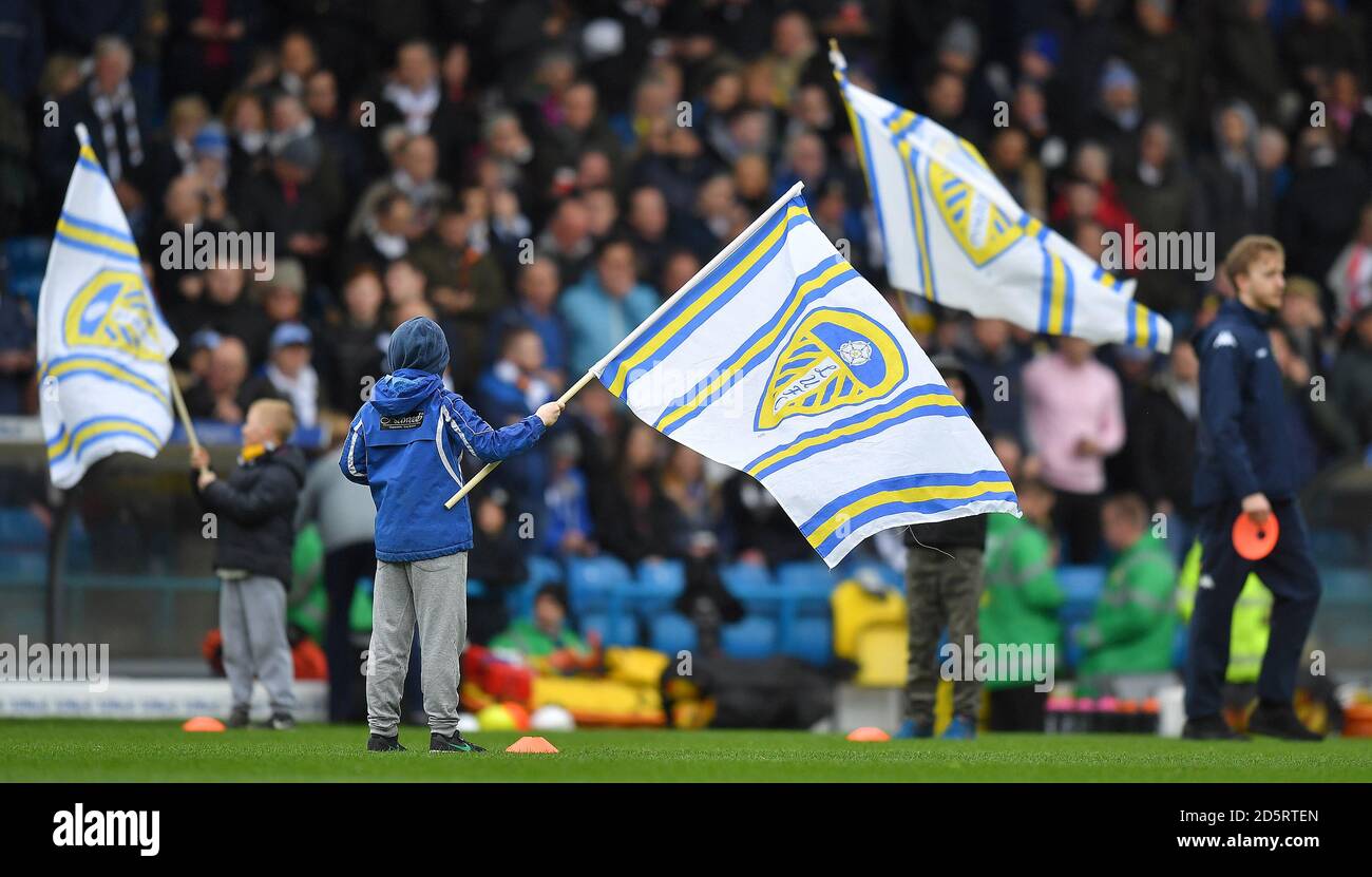 Ballboys wave Leeds United flags before kick-off Stock Photo - Alamy