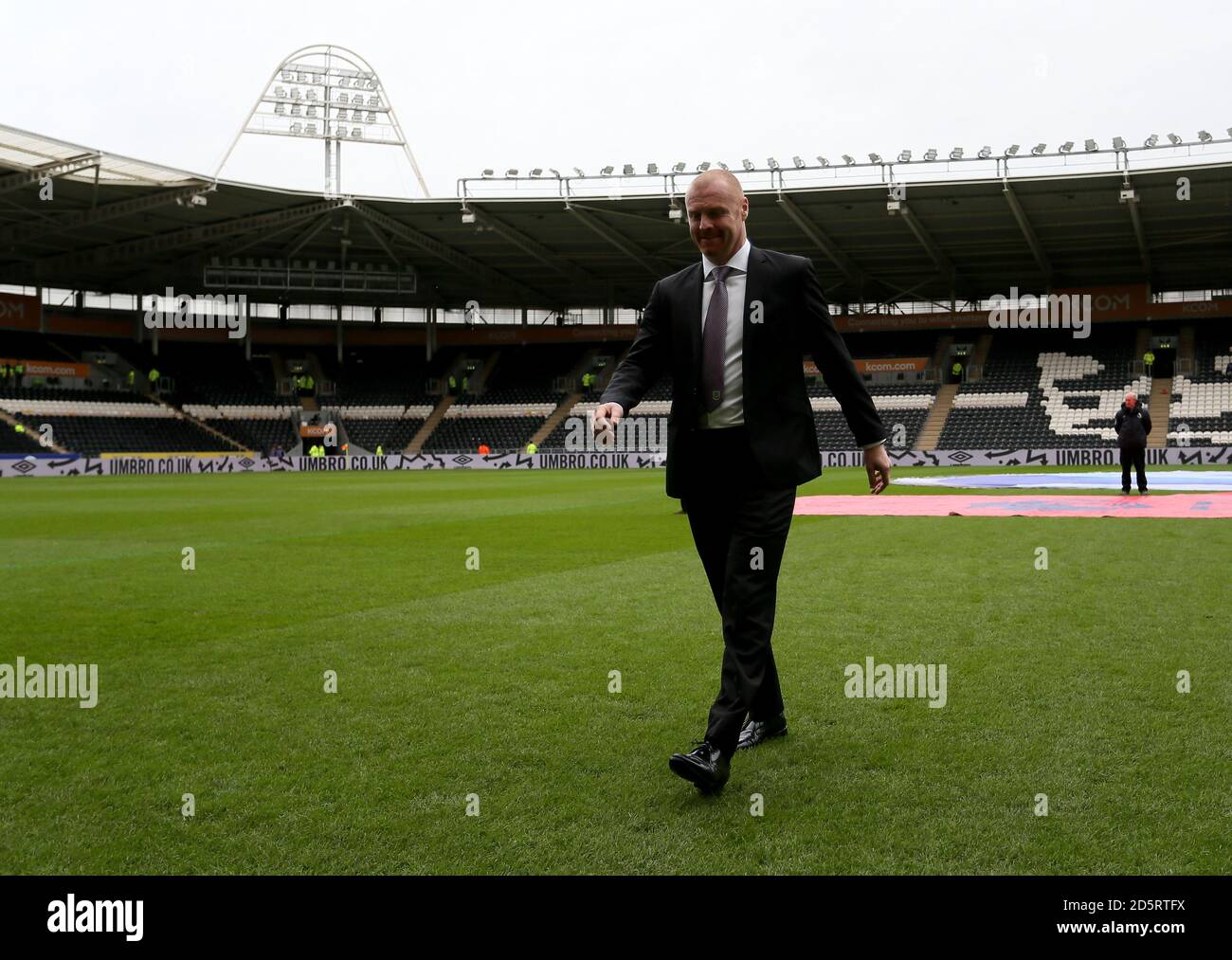 Burnley manager Sean Dyche walks on the pitch at the KCOM Stadium Stock ...