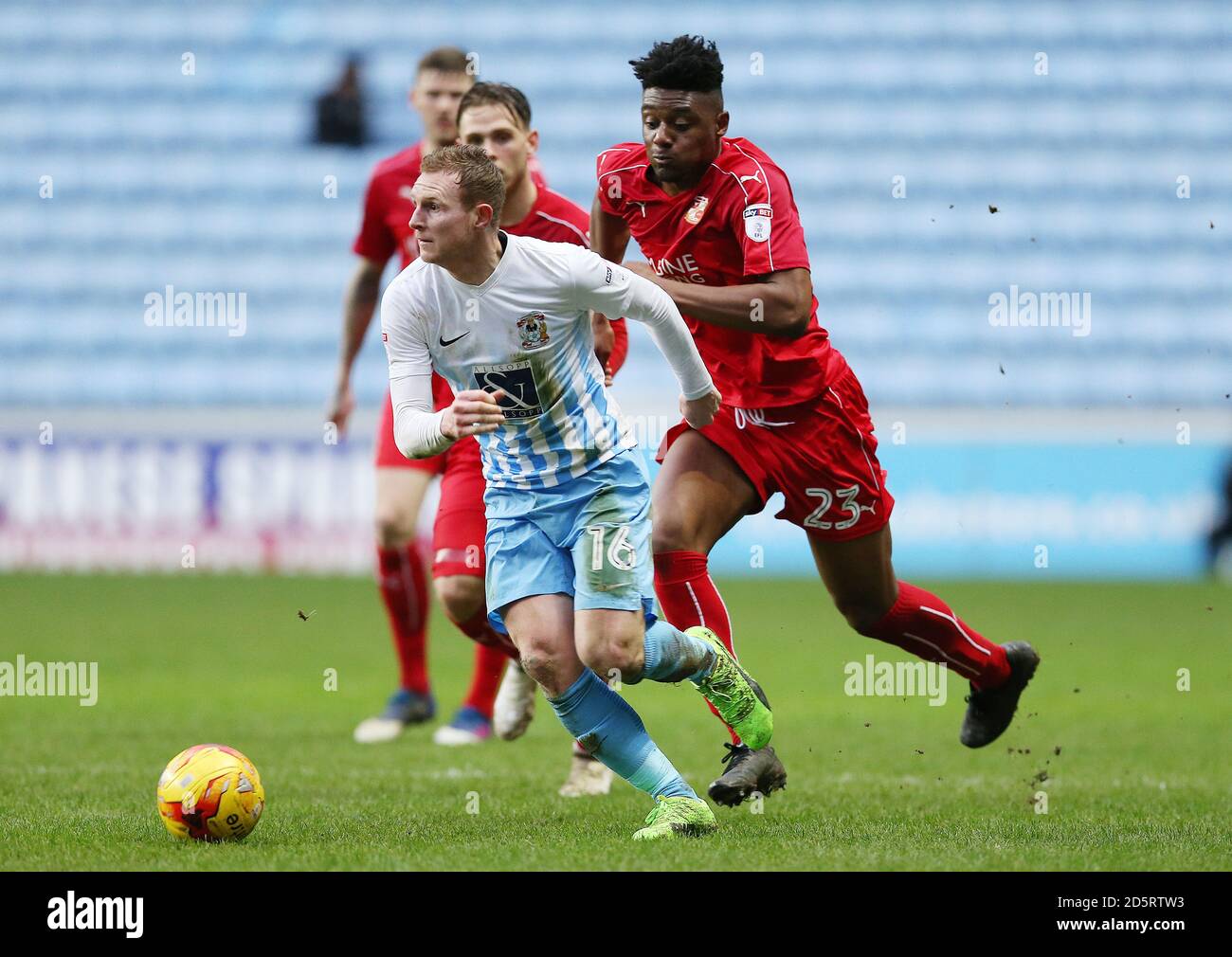 Coventry City's Stuart Beavon and Swindon Town's Rohan Ince battle for ...