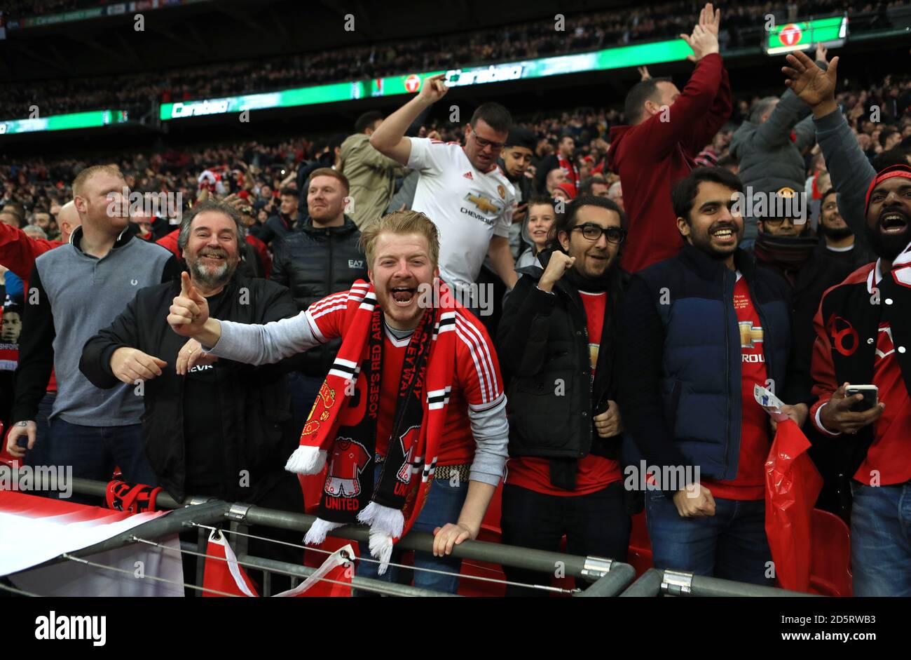 Manchester United fans celebrate their side's first goal of the game ...