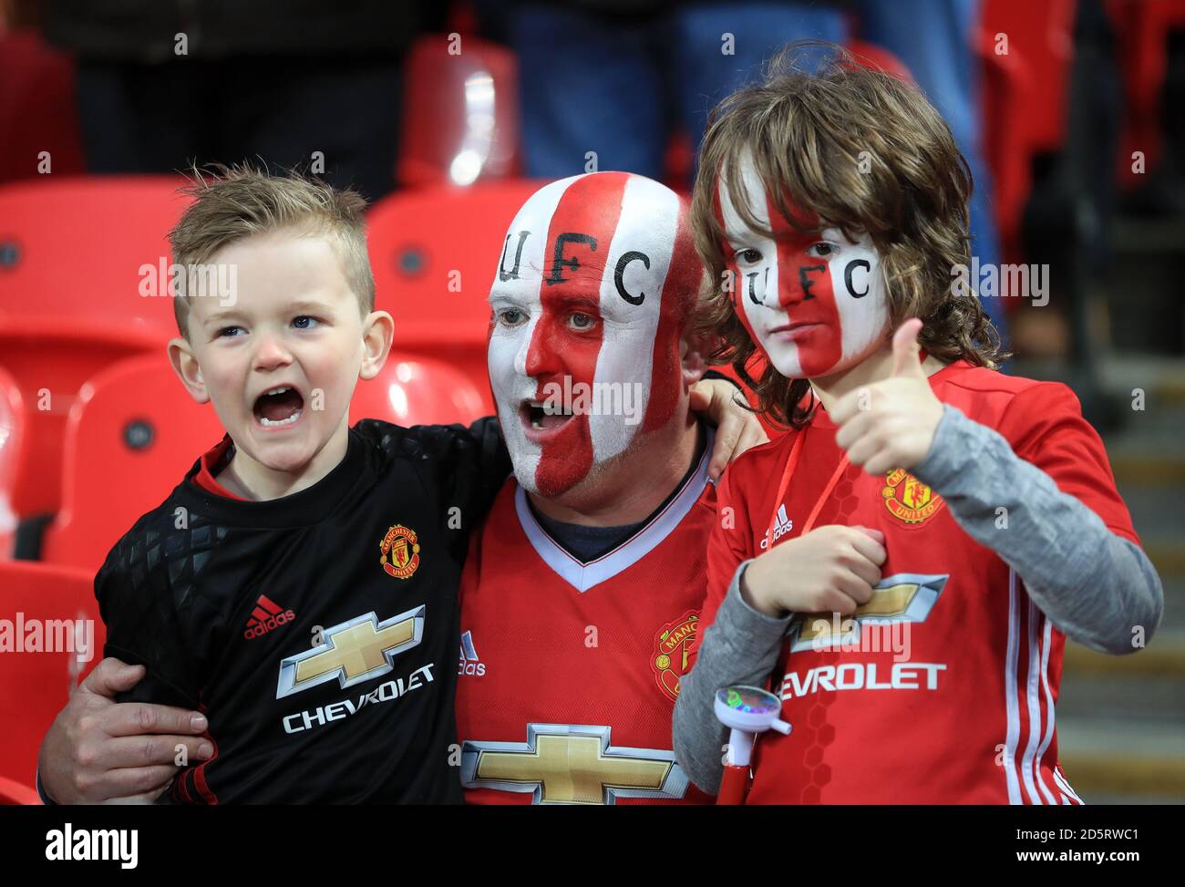 Manchester United fans in the stands show their support Stock Photo - Alamy
