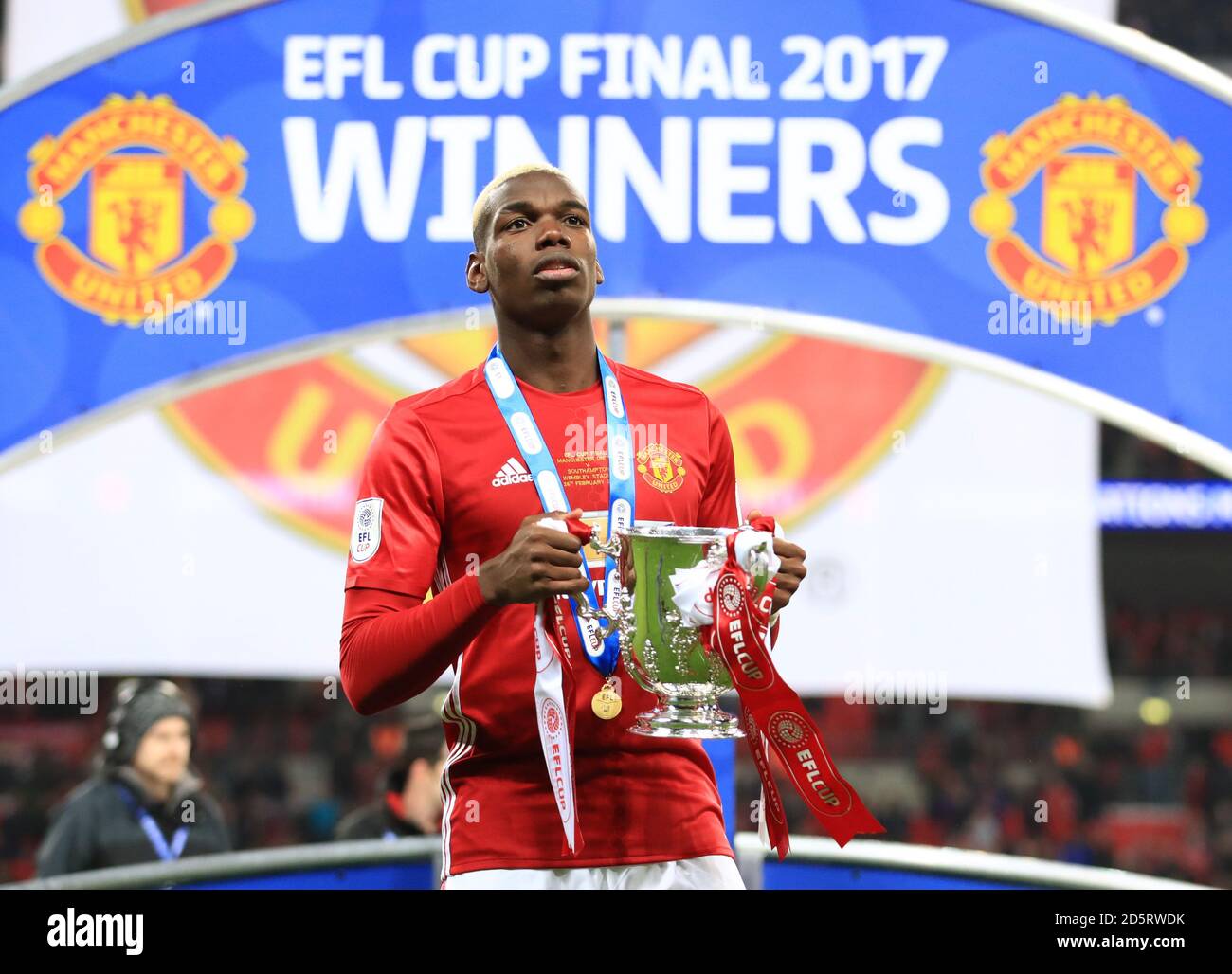 Manchester United's Paul Pogba celebrates with the EFL Cup Trophy Stock ...