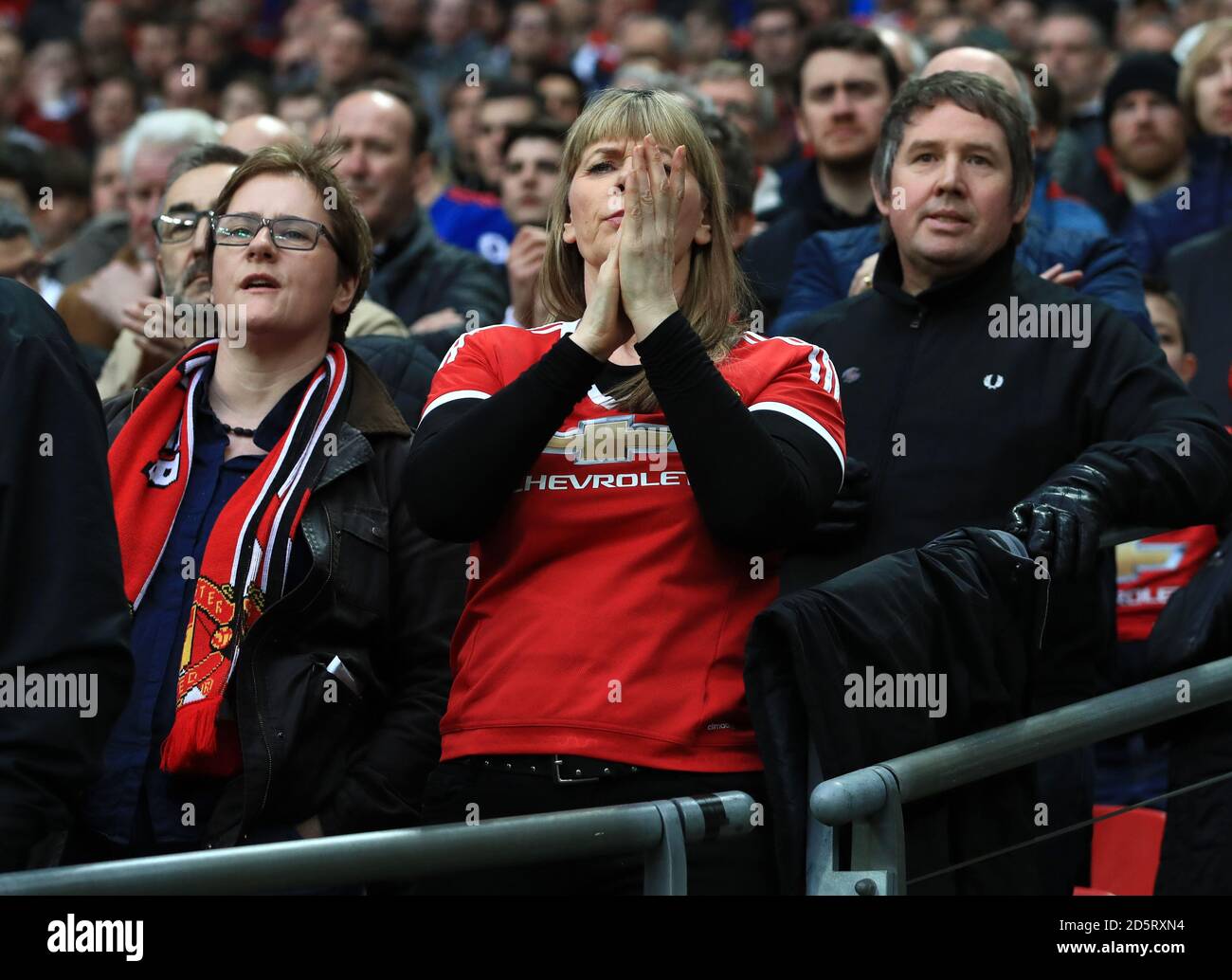 Manchester United supporters in the stands during the game Stock Photo ...