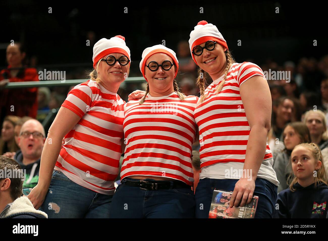 Fans wear fancy dress in the stands Stock Photo - Alamy