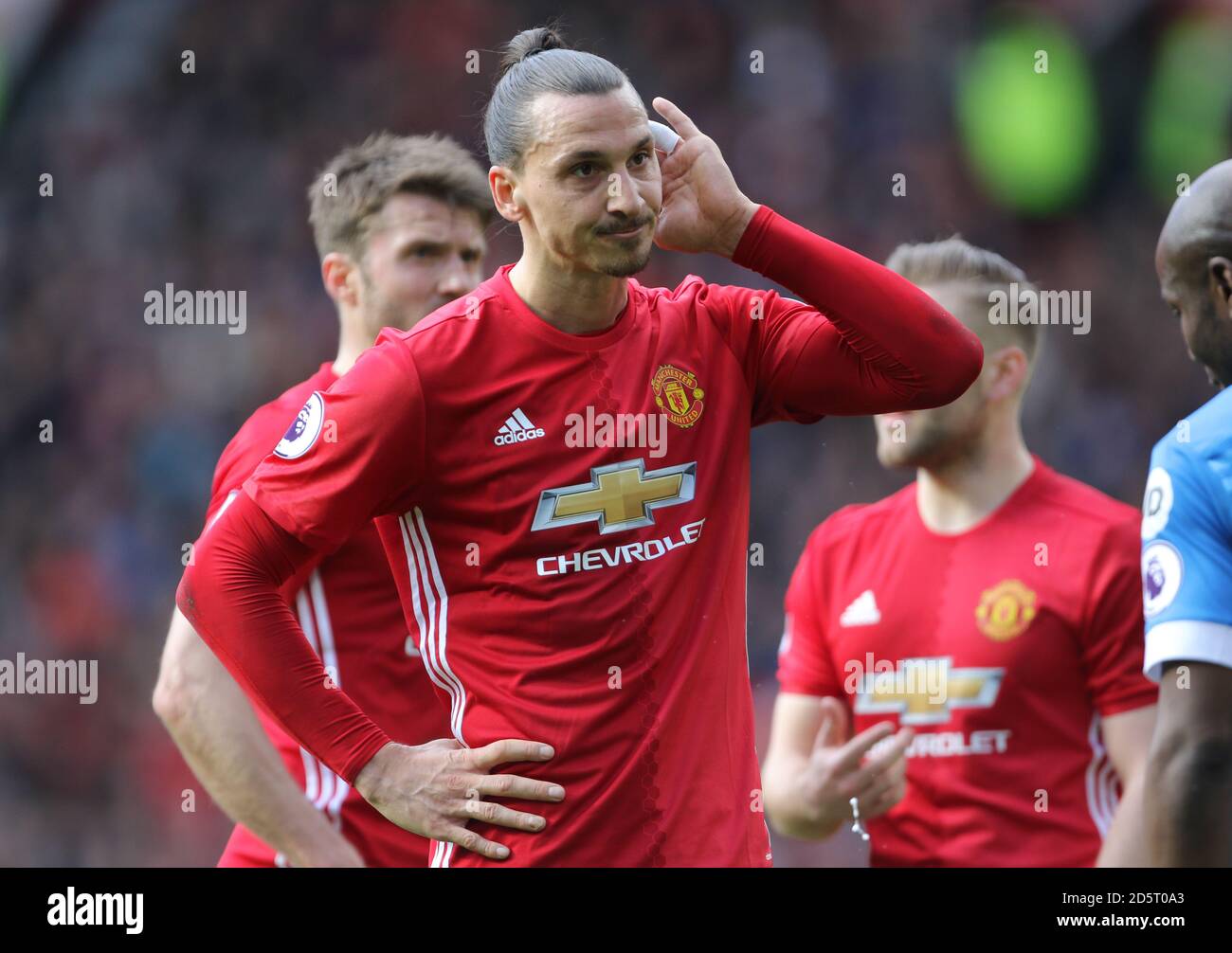 Manchester United's Zlatan Ibrahimovic holds the back of his head after ...