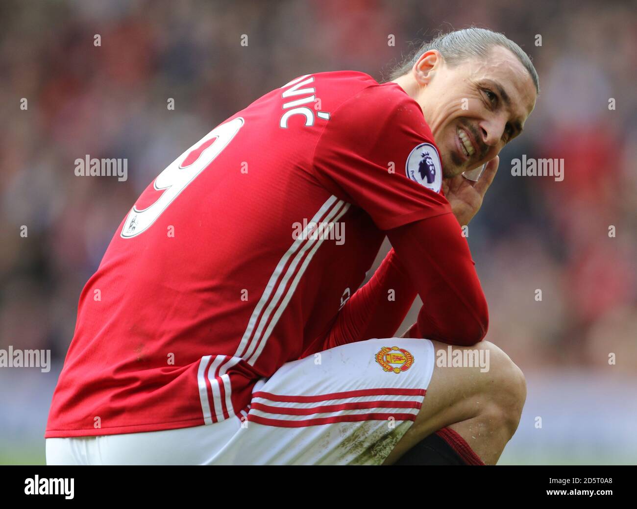 Manchester United's Zlatan Ibrahimovic holds the back of his head after ...