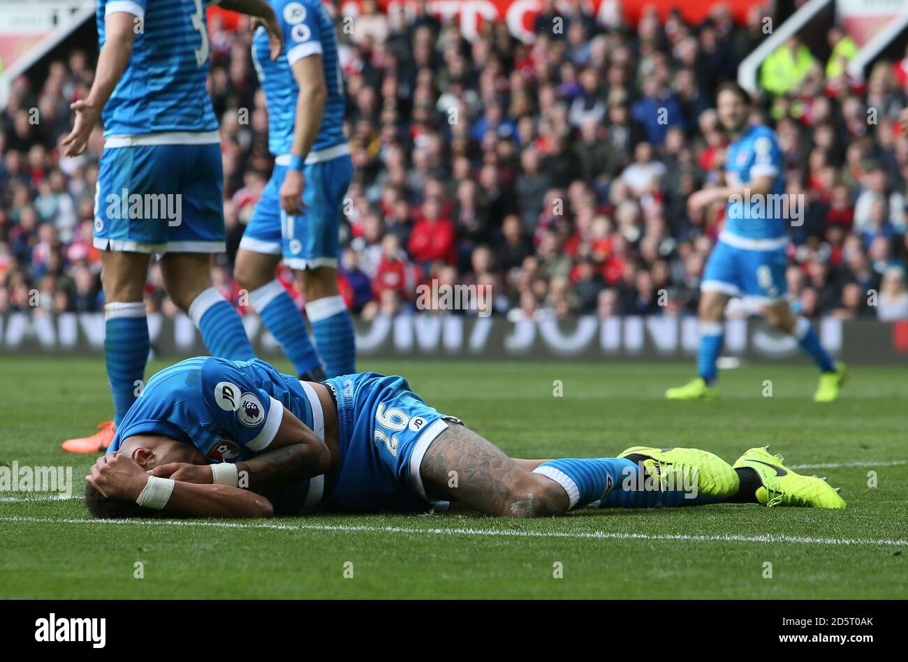 AFC Bournemouth's Tyrone Mings hold his ear after and elbow by ...