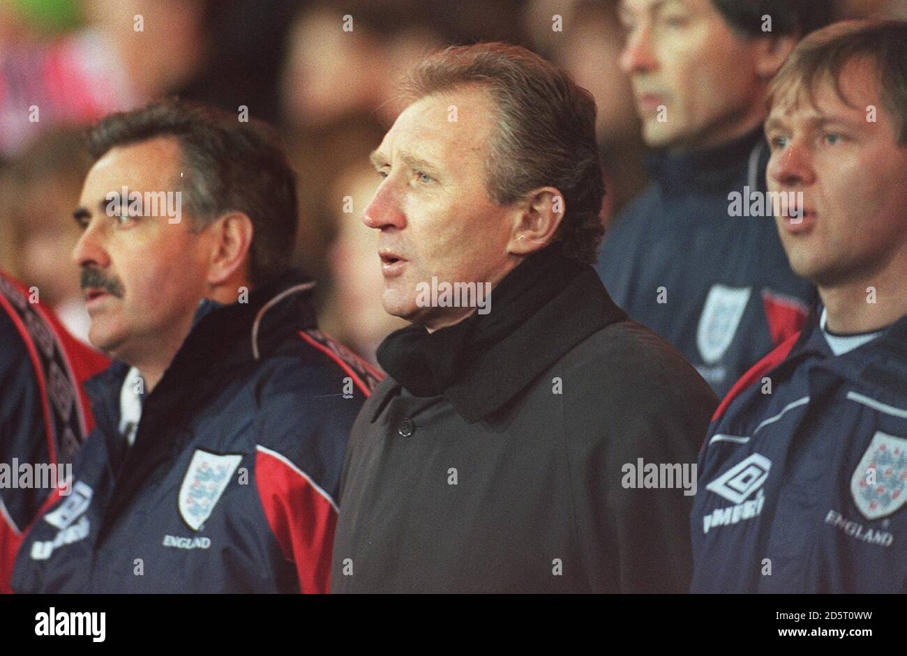 England Manager Howard Wilkinson sings out the National Anthem as he ...