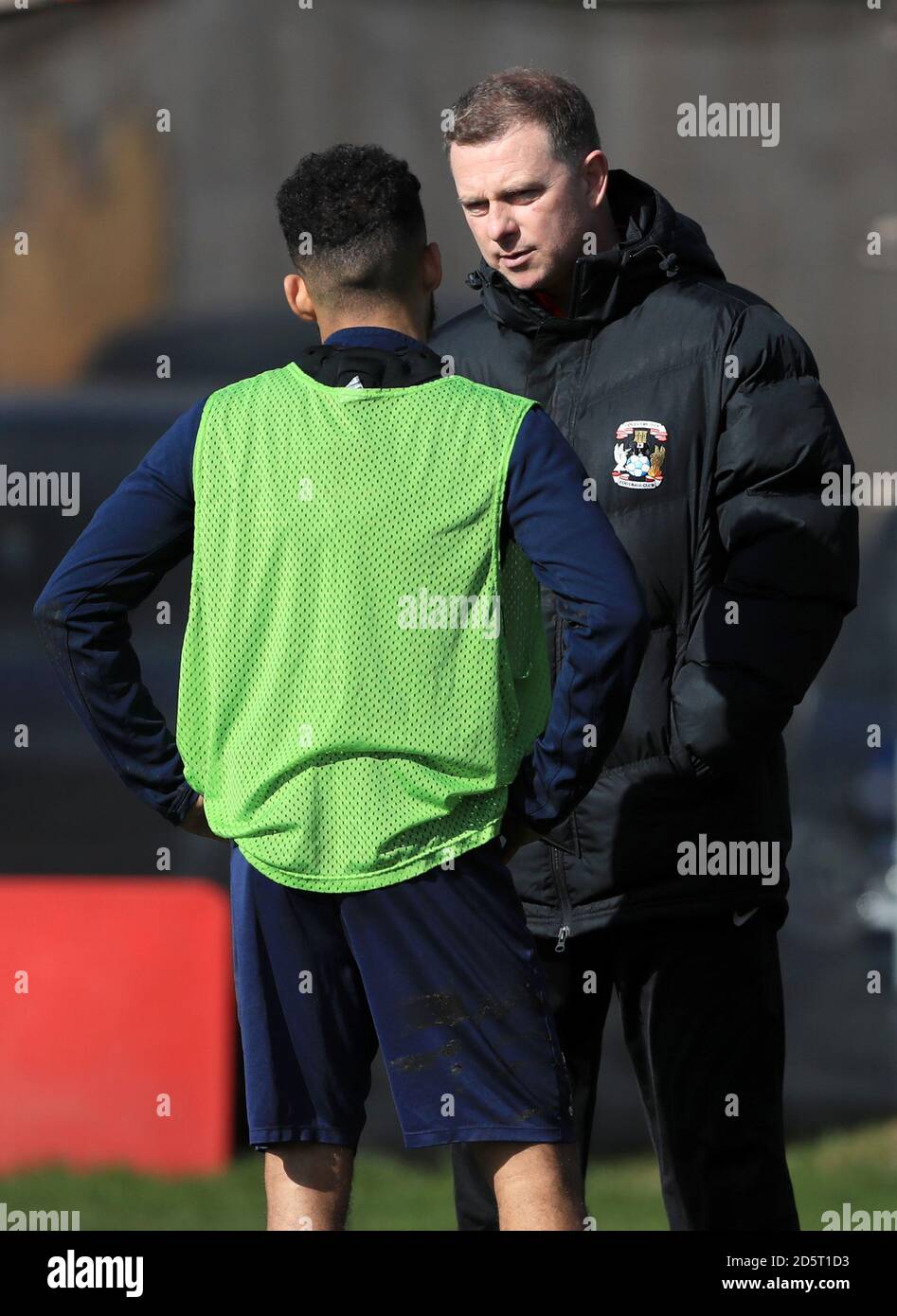 Coventry City manager Mark Robins and Devon Kelly-Evans during a ...