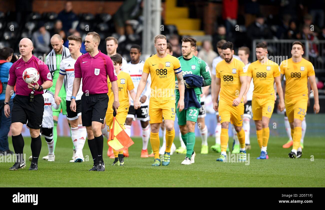 The two team's walk out before kick-off Stock Photo - Alamy