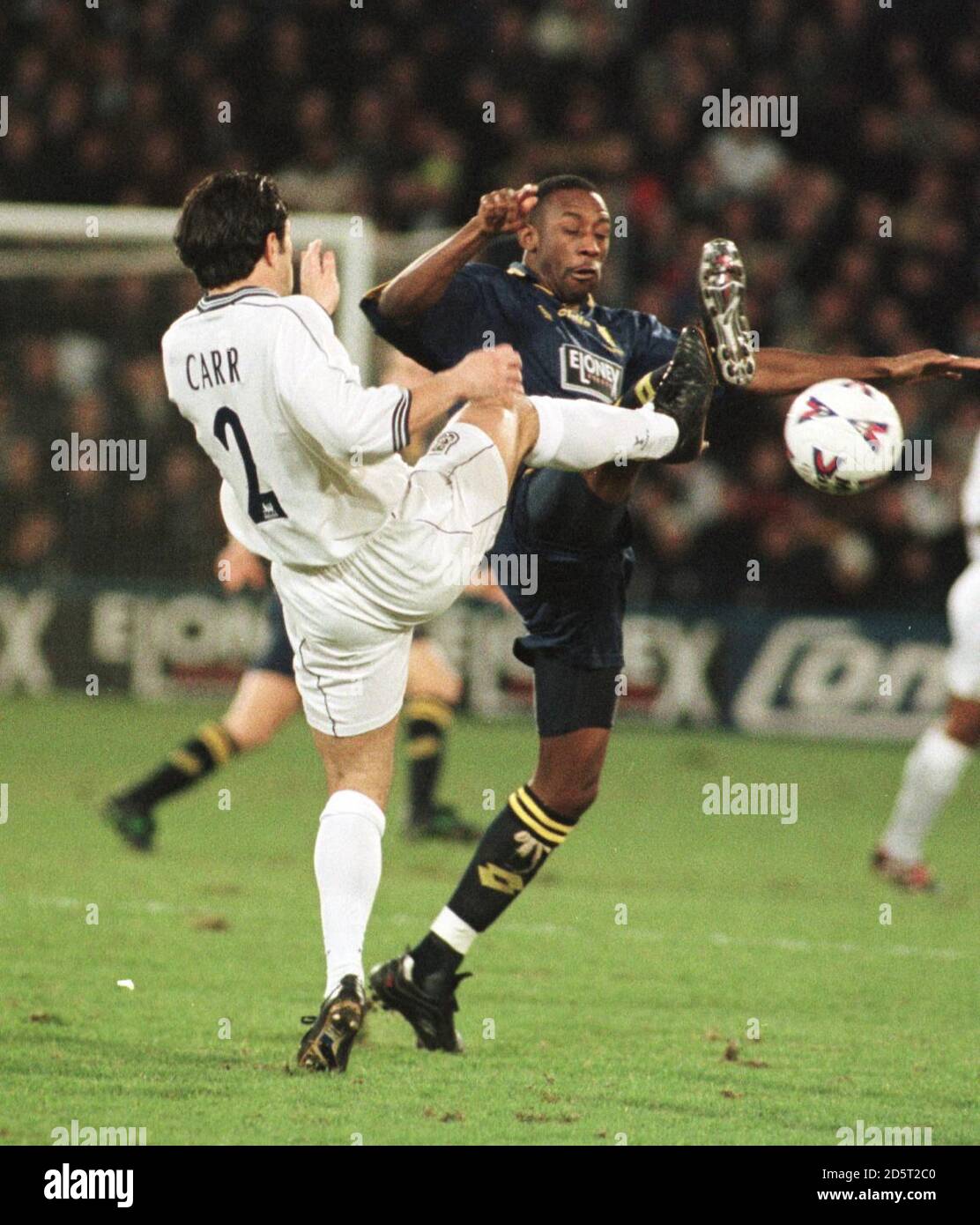 Wimbledon's Jason Euell clashes with Tottenham Hotspur's Stephen Carr ...