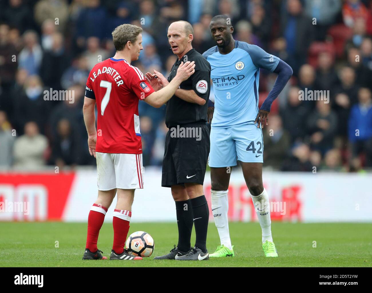 Middlesbrough's Grant Leadbitter (left) speaks with match referee Mike ...