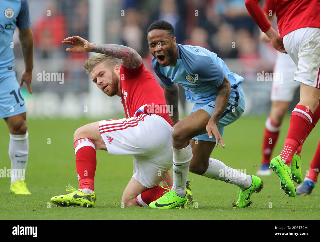 Middlesbrough's Adam Clayton (left) and Manchester City's Raheem ...