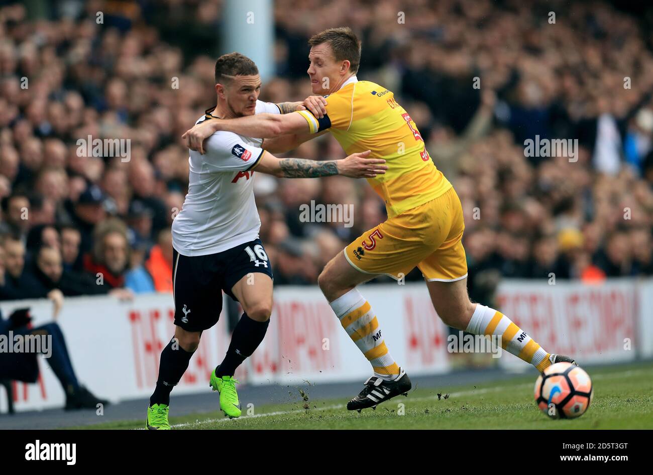 Millwall's Tony Craig (right) fouls Tottenham Hotspur's Kieran Trippier ...