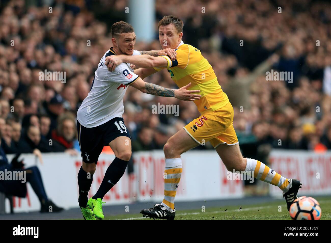 Millwall's Tony Craig (right) fouls Tottenham Hotspur's Kieran Trippier ...