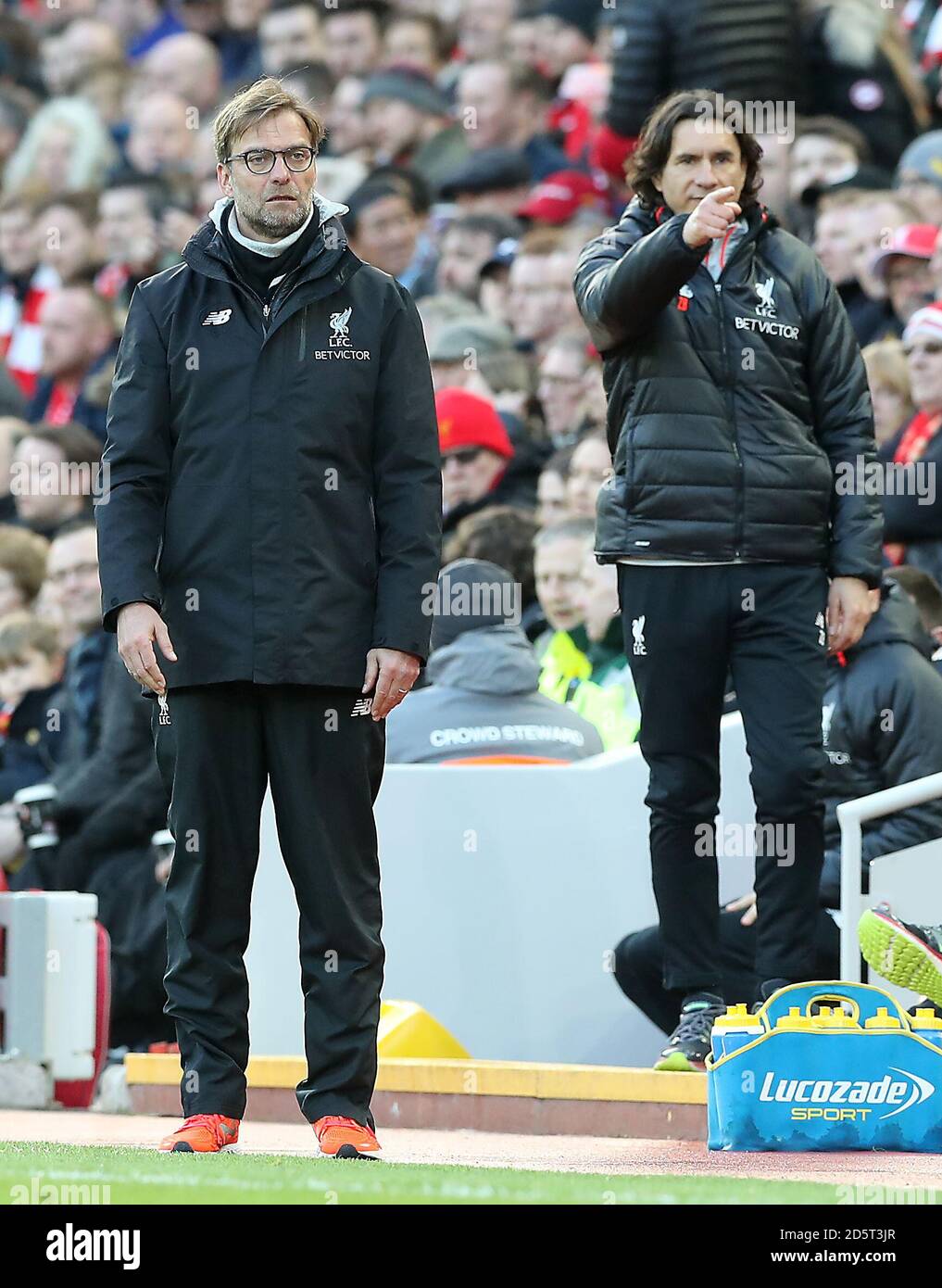 Liverpool manager Jurgen Klopp (left) looks dejected on the touchline ...