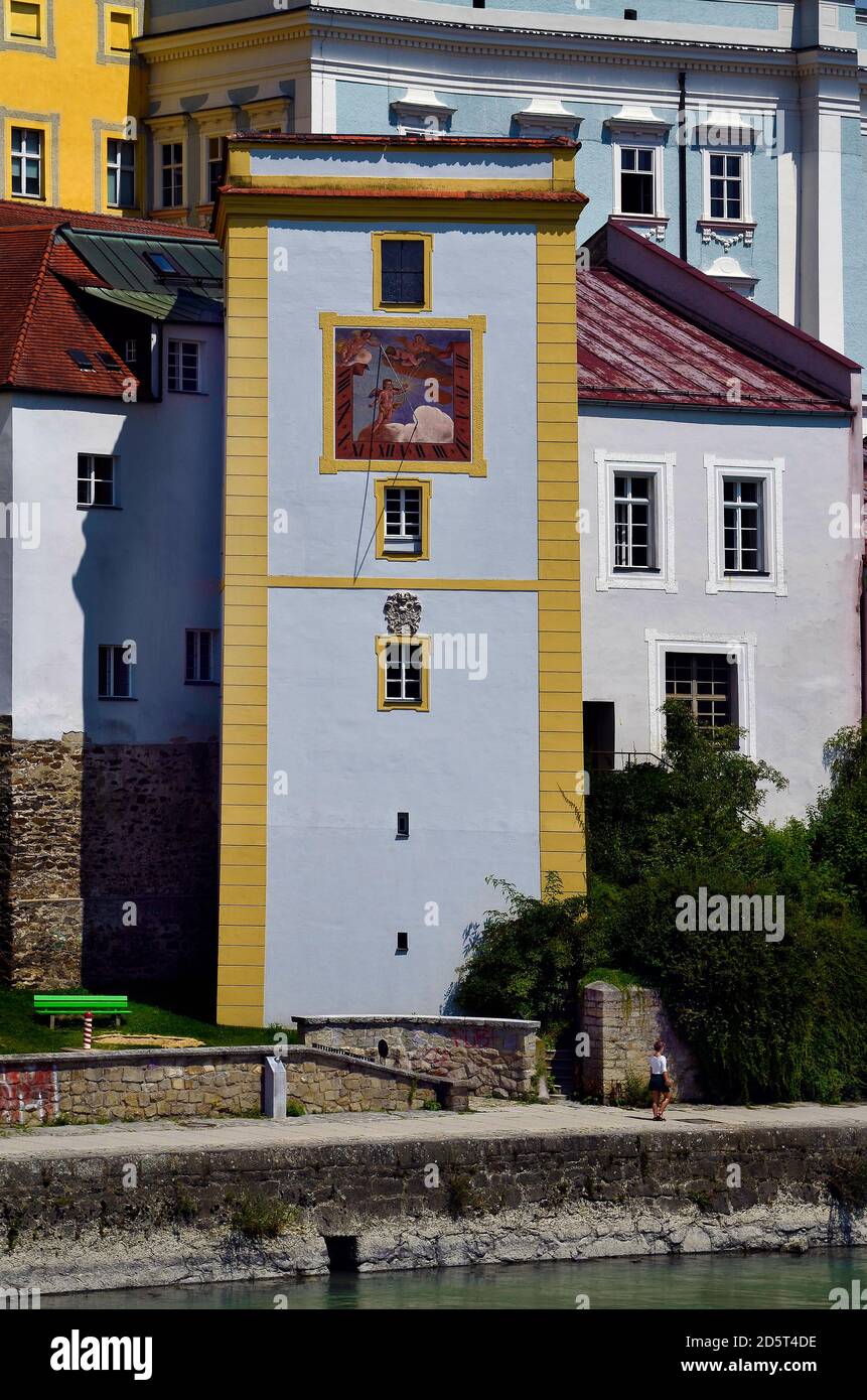 Germany, sun dial on building at Inn river promenade in the city of ...