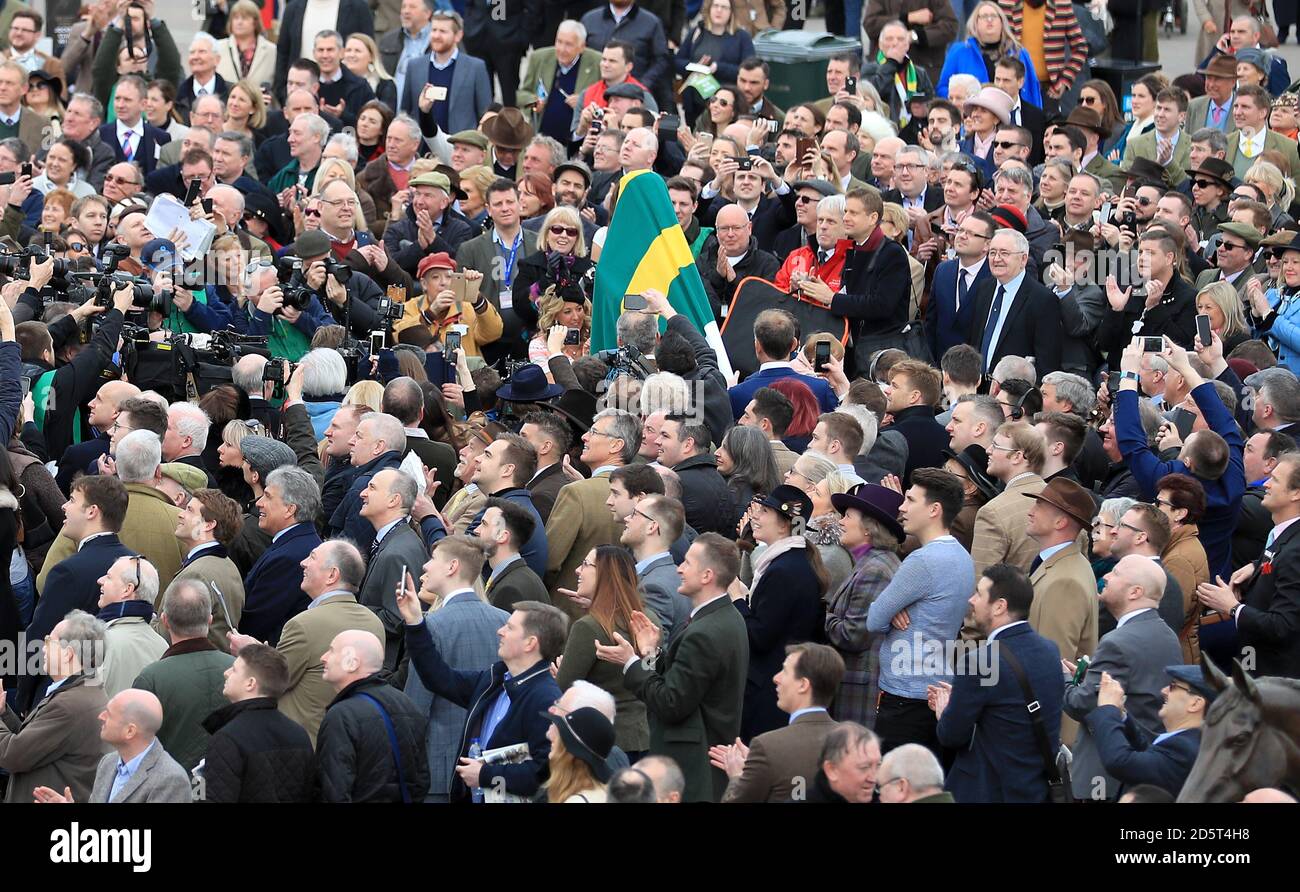 Racegoers and media watch the unveiling of the new AP McCoy statue ...