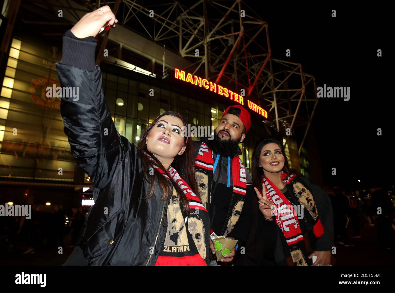 Fans outside of Old Trafford show their support before the game Stock ...