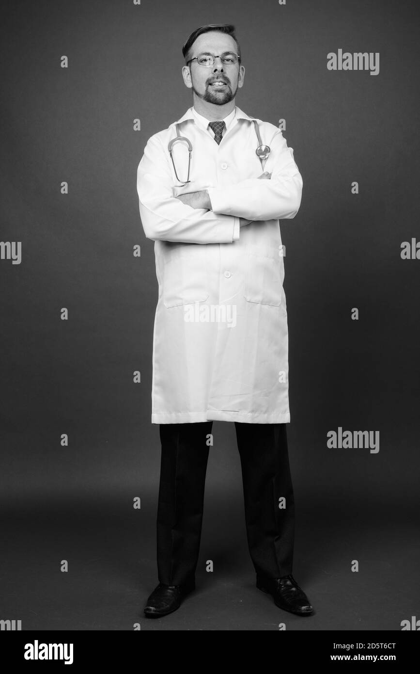 Blond bearded man doctor with goatee against gray background Stock ...