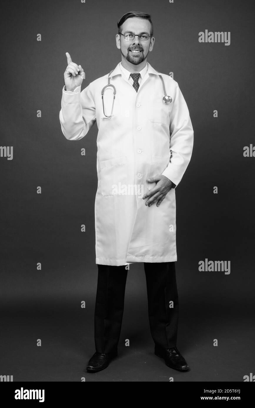 Blond bearded man doctor with goatee against gray background Stock ...