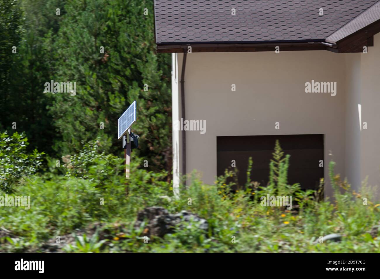 The solar battery next to the house is a modern device for saving money ...