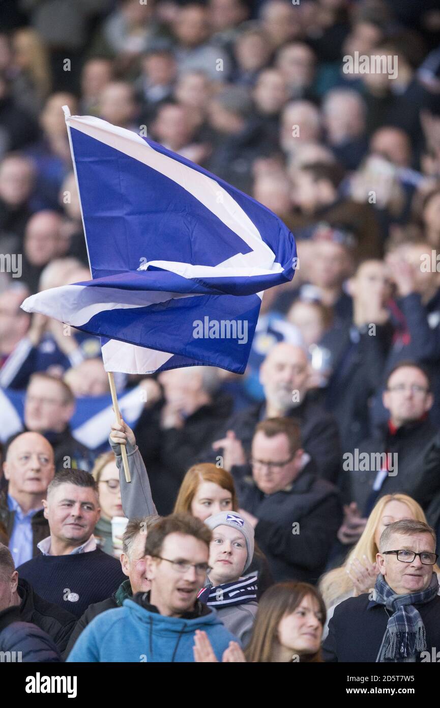 Scotland fans wave a Saltire Stock Photo - Alamy
