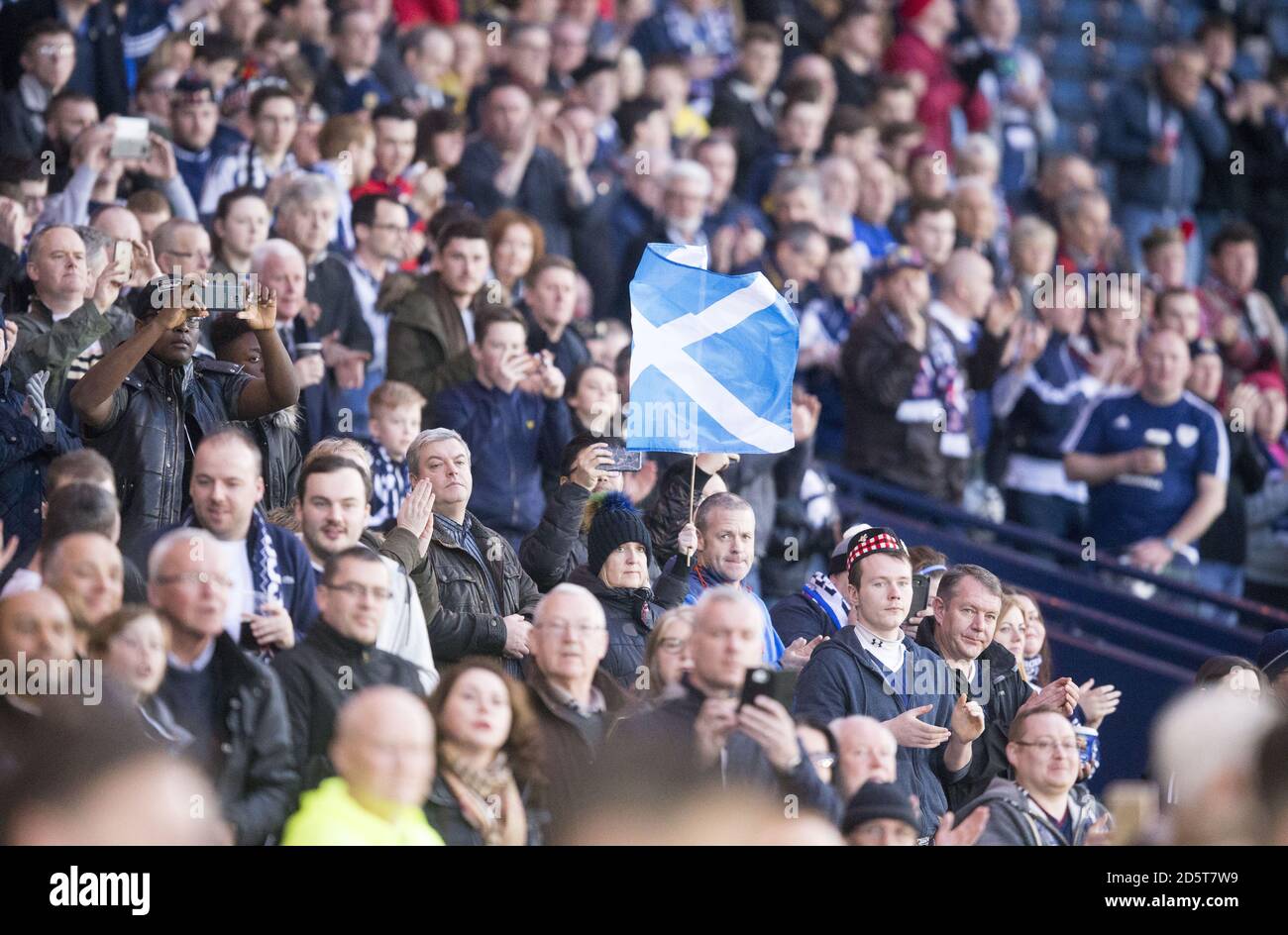 Scotland fans wave a Saltire Stock Photo - Alamy
