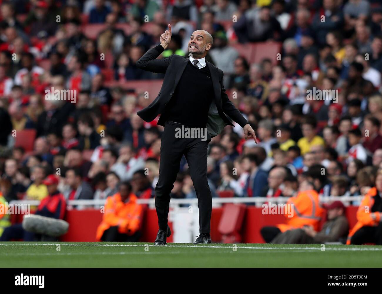 Manchester City manager Pep Guardiola gestures on the touchline Stock ...