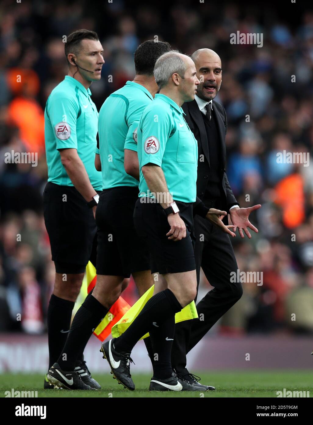 Manchester City manager Pep Guardiola speaks to match referee Andre ...