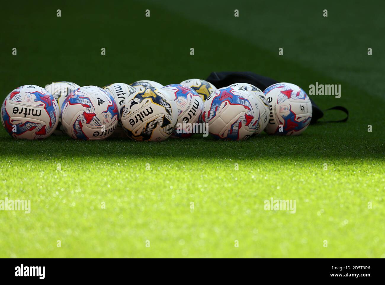 Mitre footballs on the pitch prior to the match Stock Photo - Alamy
