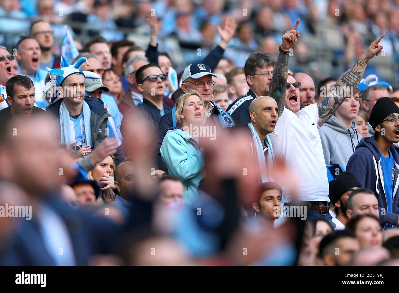 Coventry City fans in the stands Stock Photo - Alamy