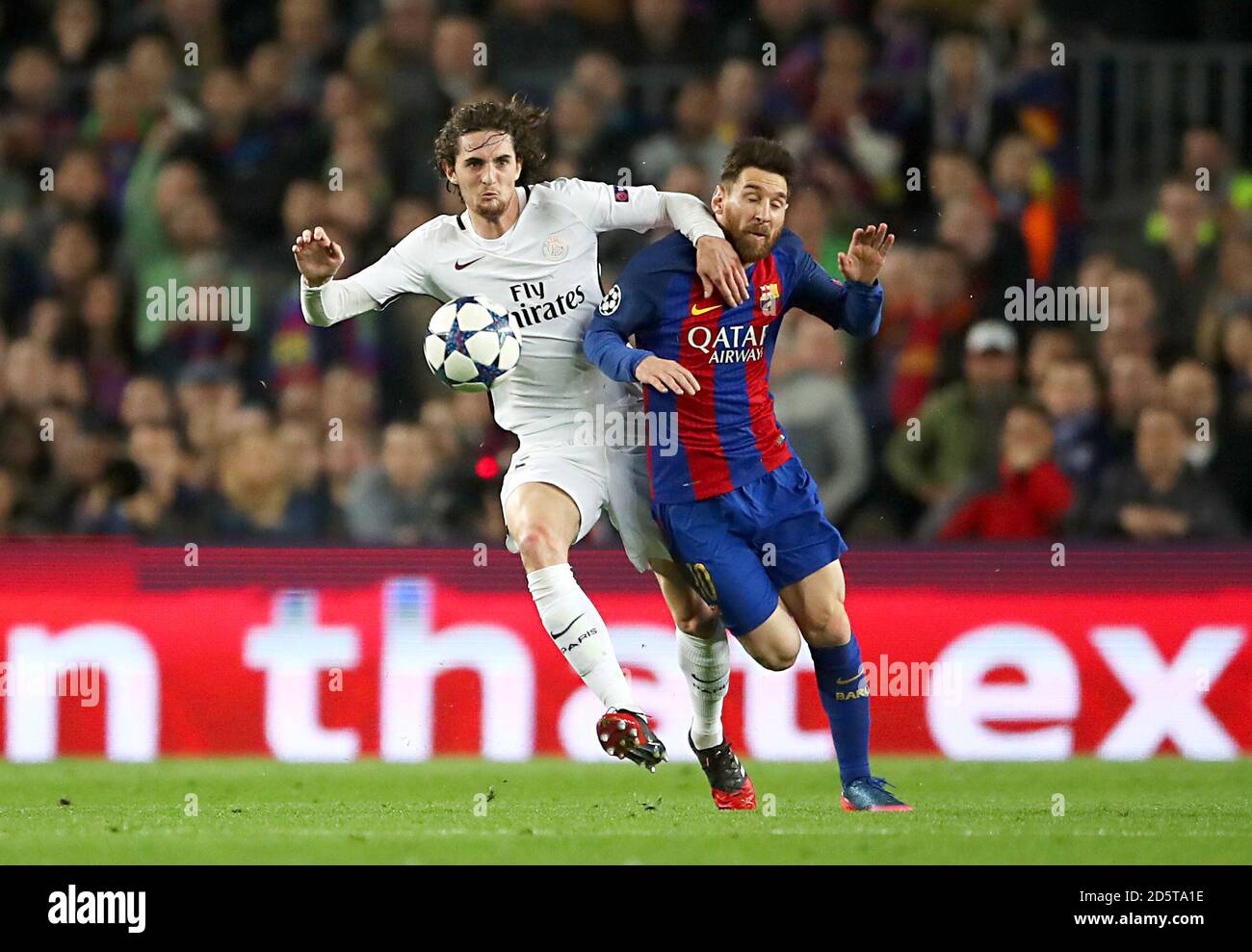 Paris Saint-Germain's Adrien Rabiot and Barcelona's Lionel Messi battle ...