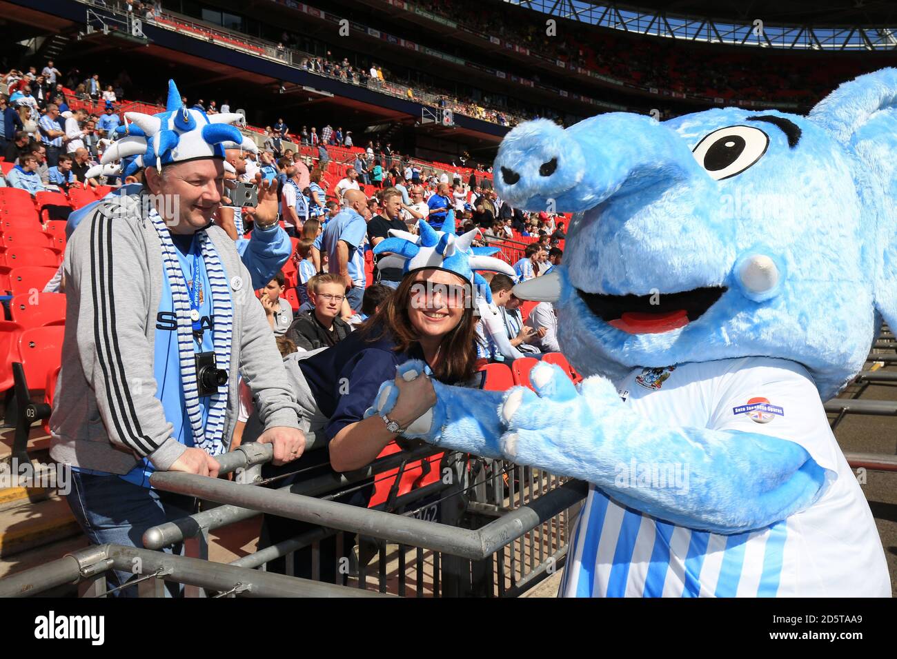 Coventry City club mascot Sky Blue Sam with supporters Stock Photo - Alamy