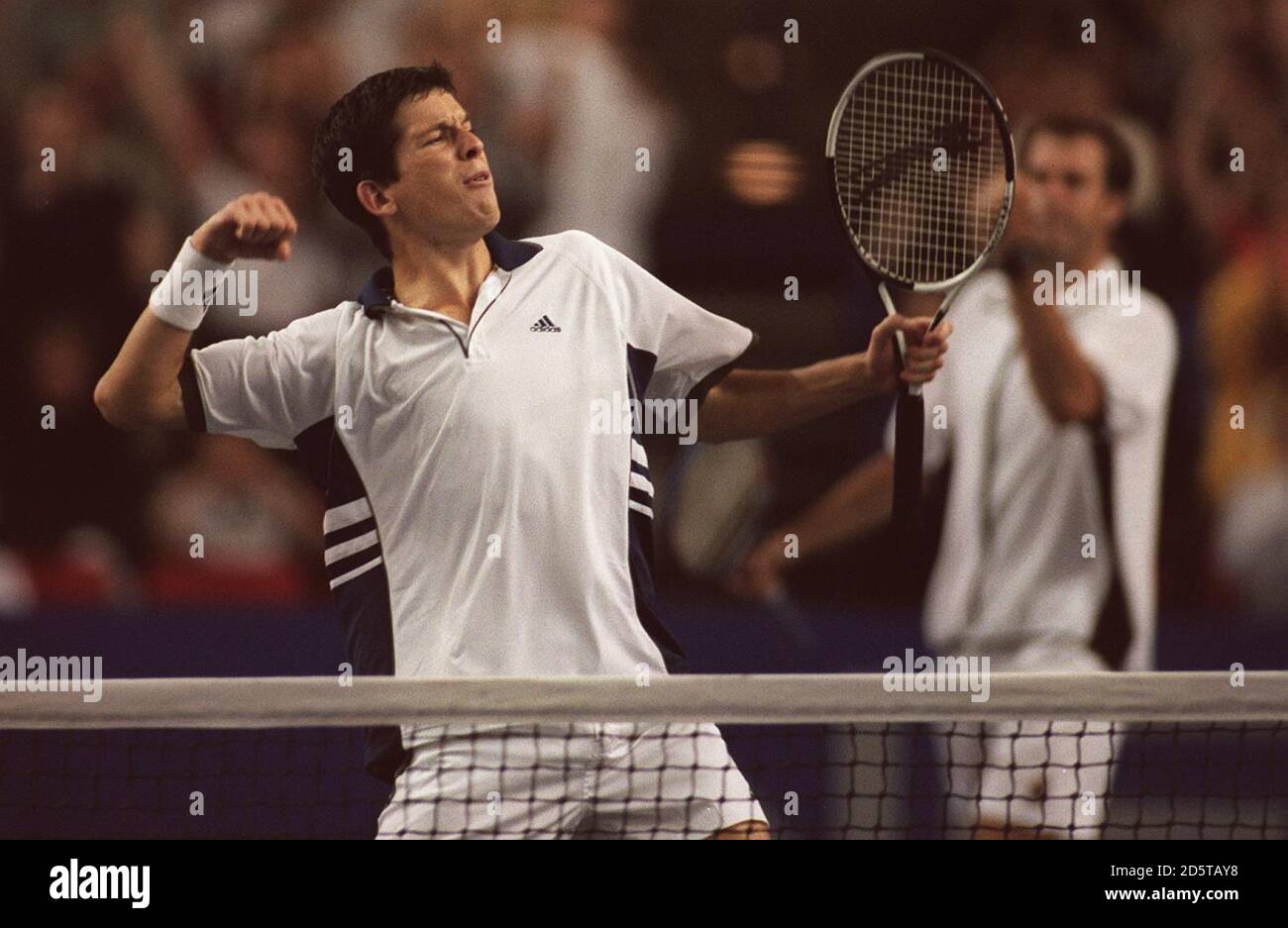 Tim Henman and Greg Rusedski clinch a vital point during the match ...