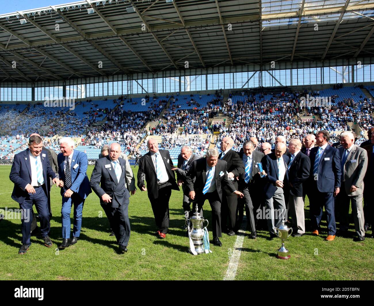 Coventry City's legends are caught out by the sprinklers Stock Photo ...