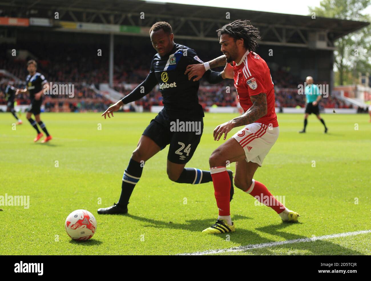 Nottingham Forest's Armand Traore and Blackburn Rovers' Ryan Nyambe ...