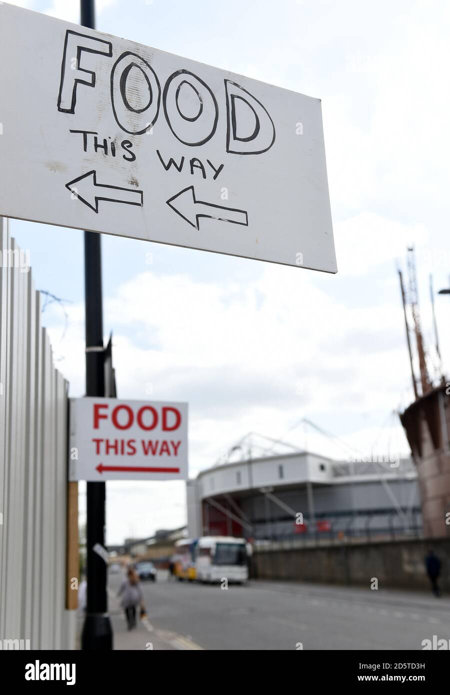 A Food This Way sign Stock Photo - Alamy