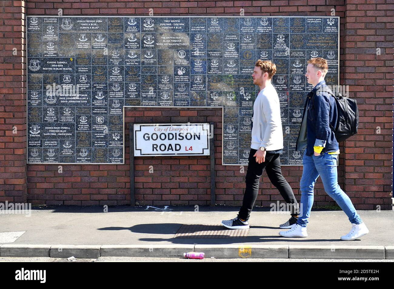 Everton fans pass a club plaque on Goodison Road Stock Photo - Alamy