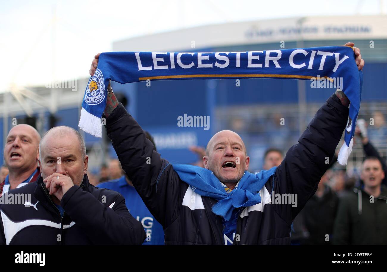 A Leicester City fan waves a scarf outside the stadium Stock Photo - Alamy
