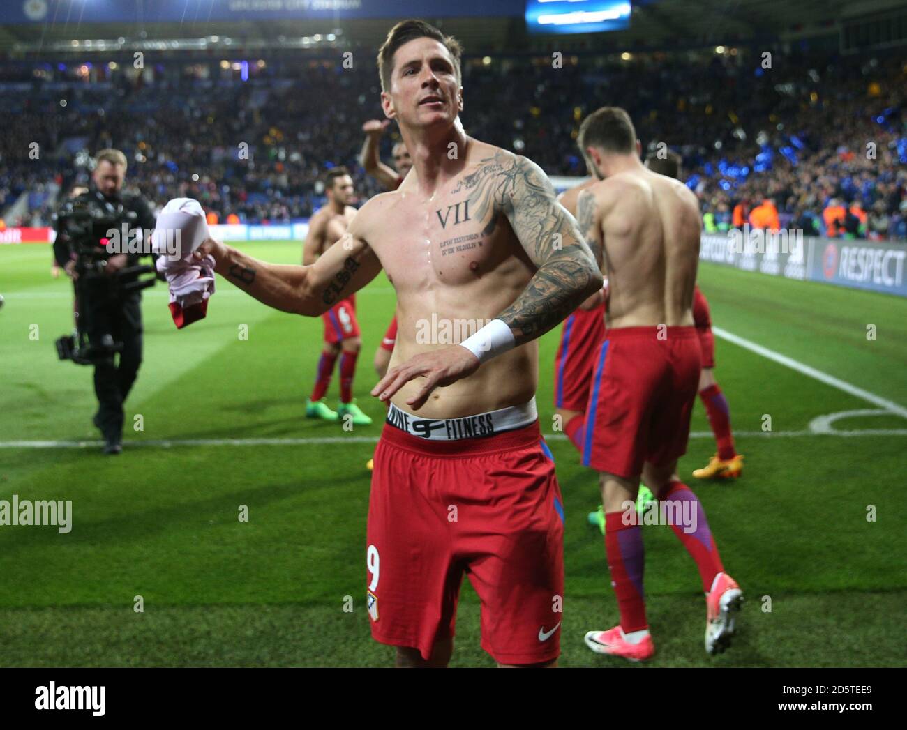 Atletico Madrid's Fernando Torres throws his shirt in the crowd after ...